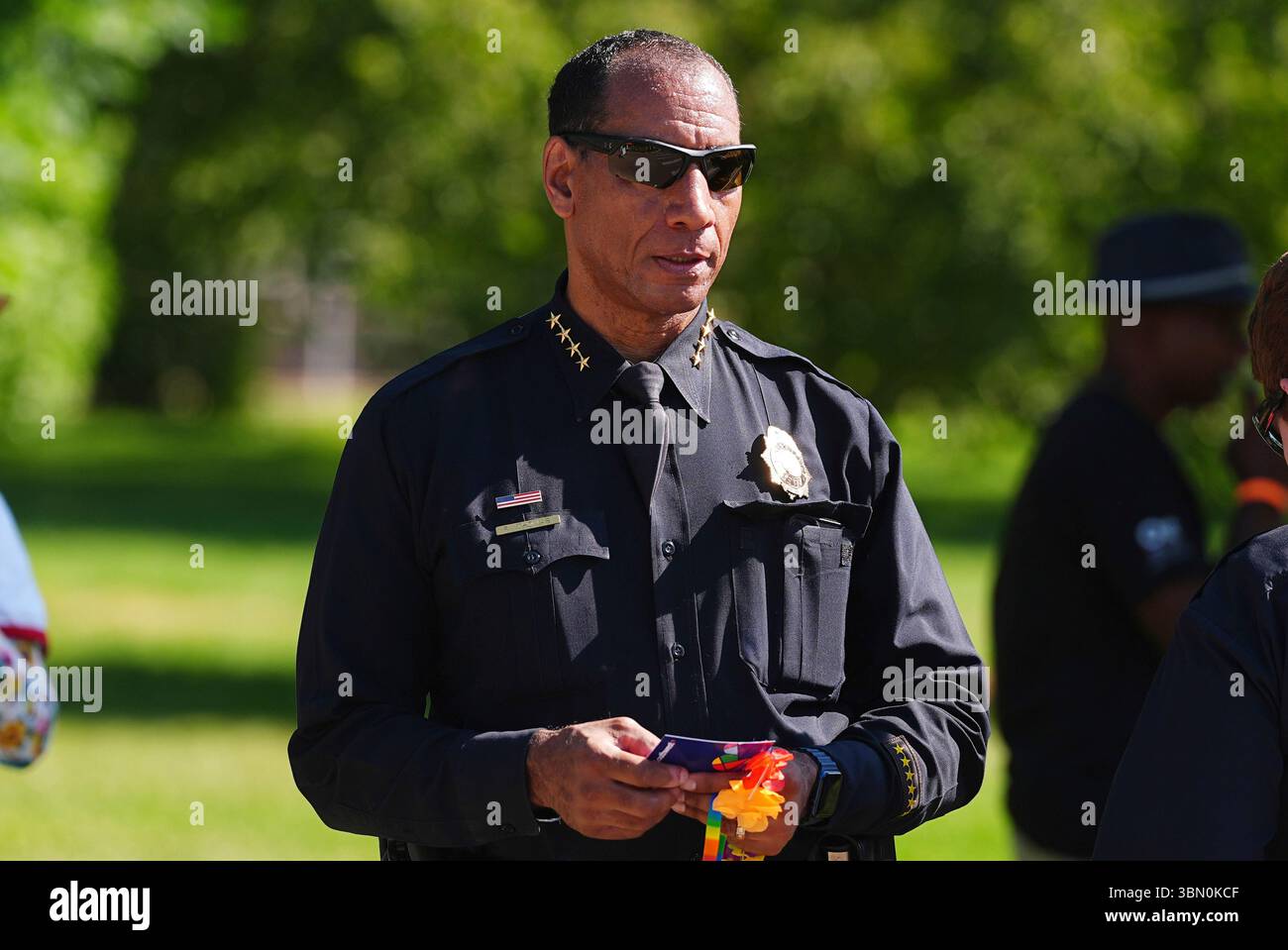 Denver Police Department Chief Ron Thomas looks on as participants in ...