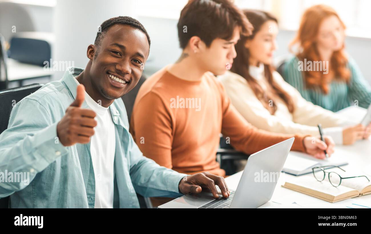 Group of international people using laptops in coworking Stock Photo ...