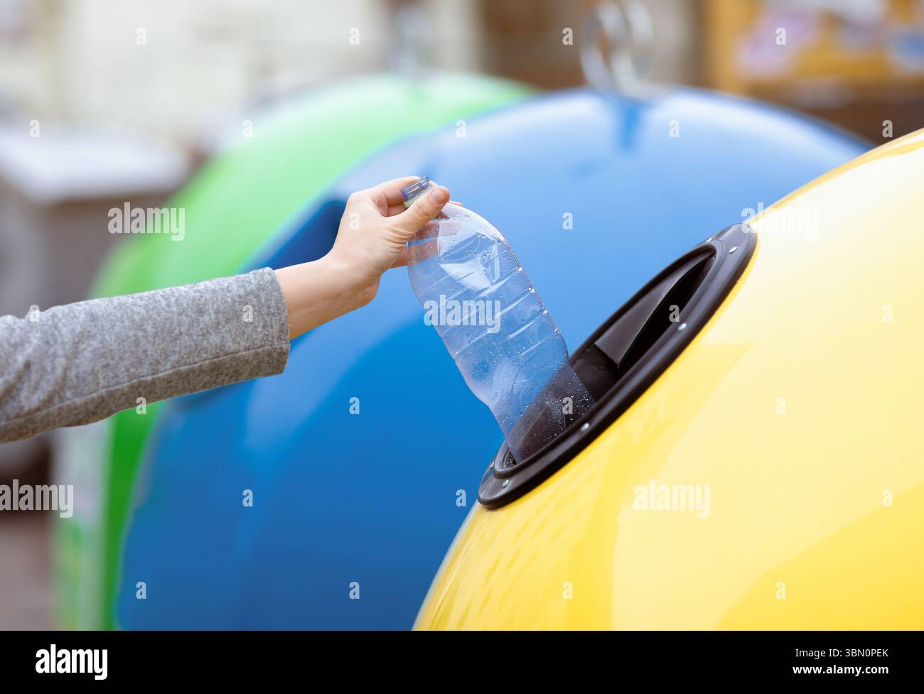 Waste Recycling Concept. Unrecognizable lady throwing plastic bottle ...