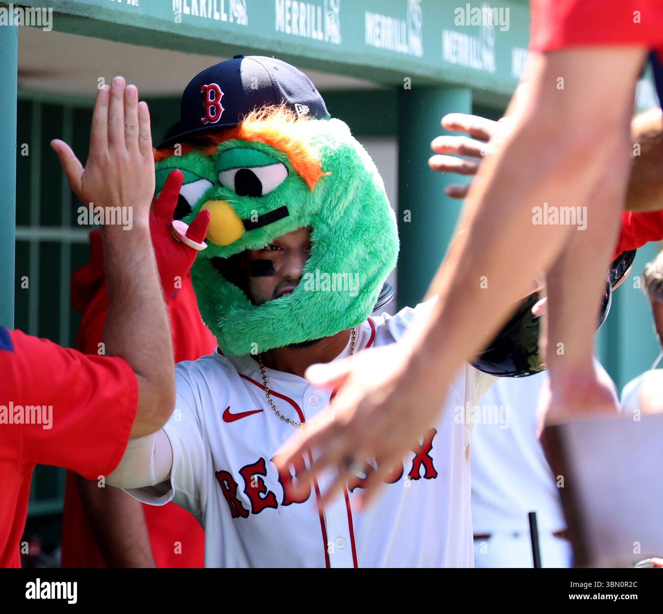 Boston Red Sox's Carlos Narváez dons a mascot head after hitting a home ...
