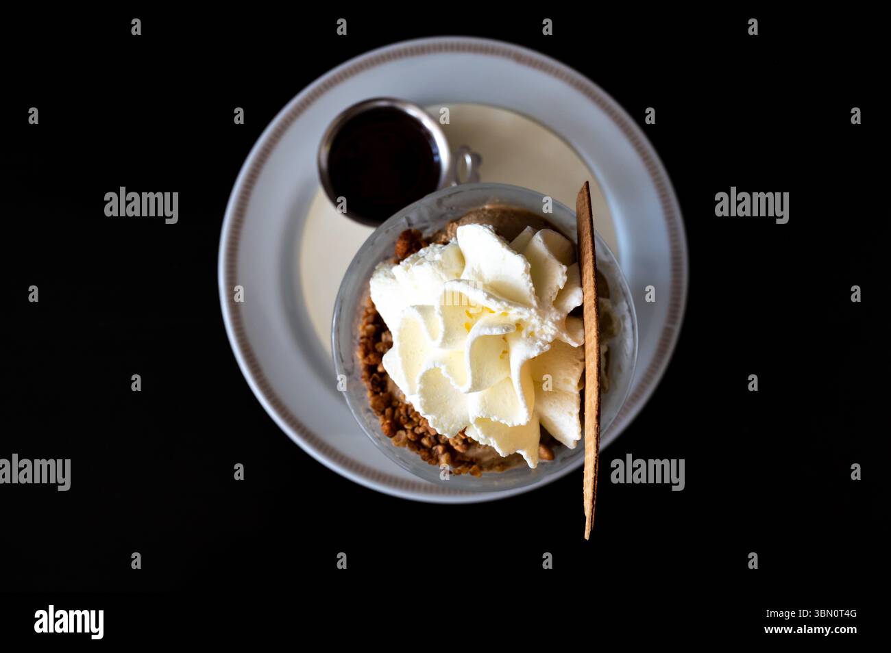 Cup of ice cream with crumble nuts and whipped cream in Keerbergen ...