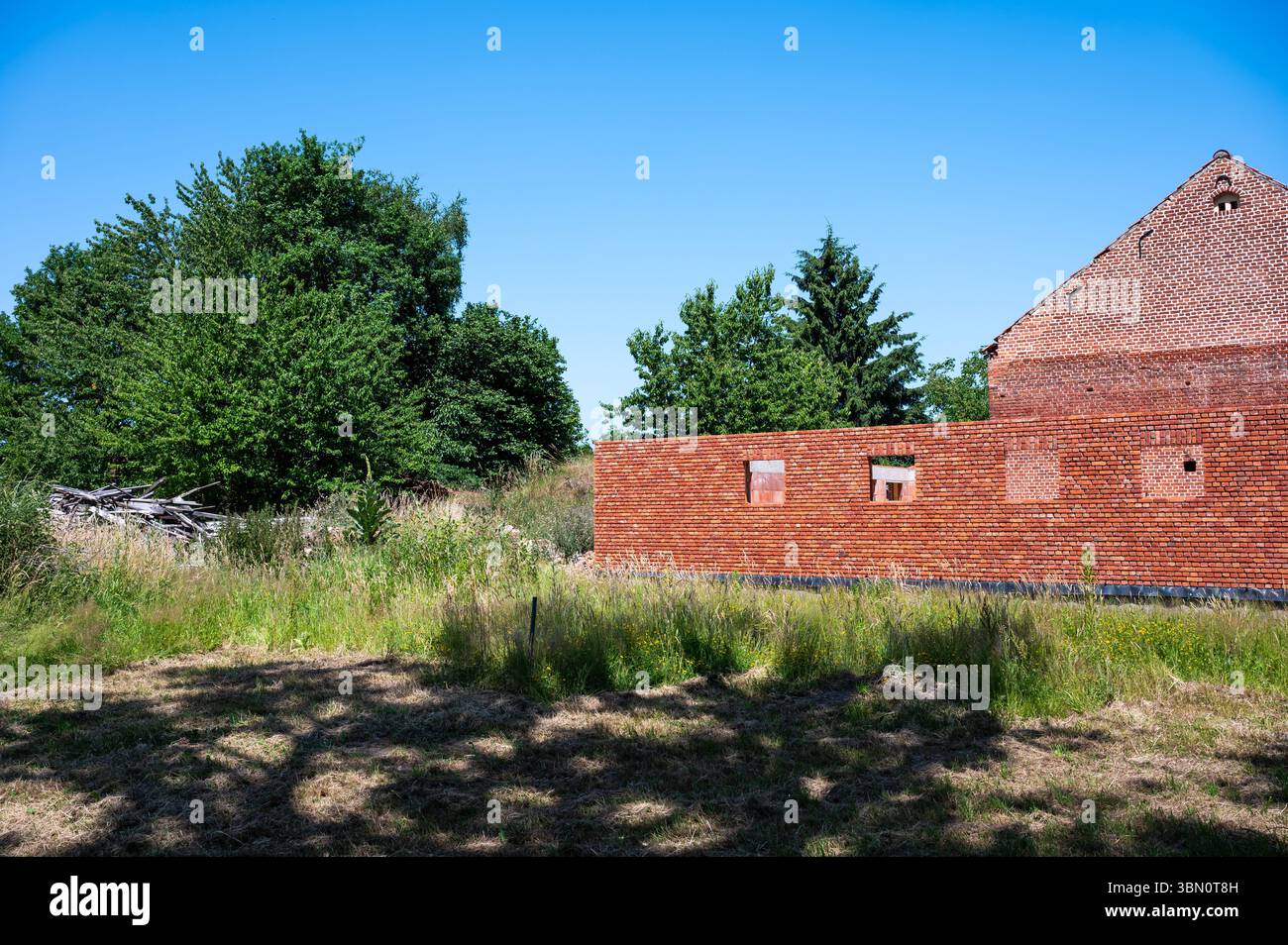 Brick stone residential house at the Flemish countryside in Heist Op ...