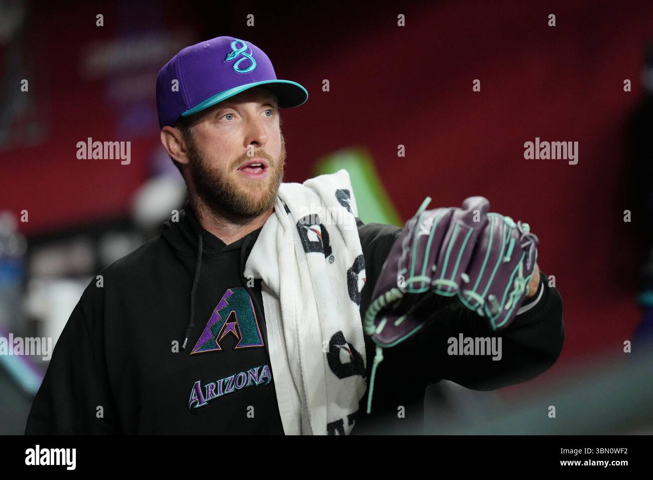 Arizona Diamondbacks pitcher Merrill Kelly walks through the dugout ...