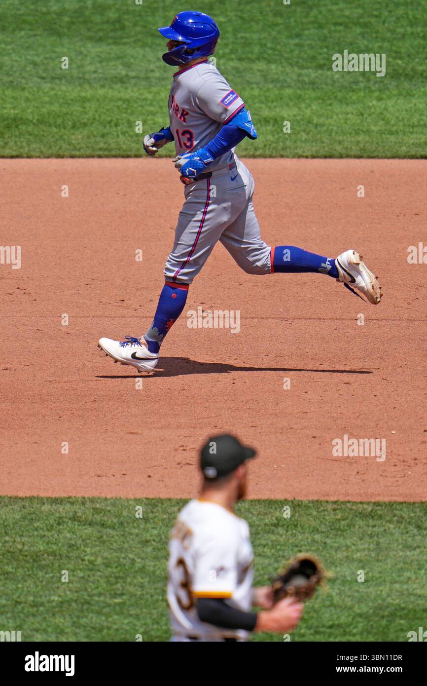 New York Mets' Luis Torrens (13) rounds the bases after hitting a solo ...