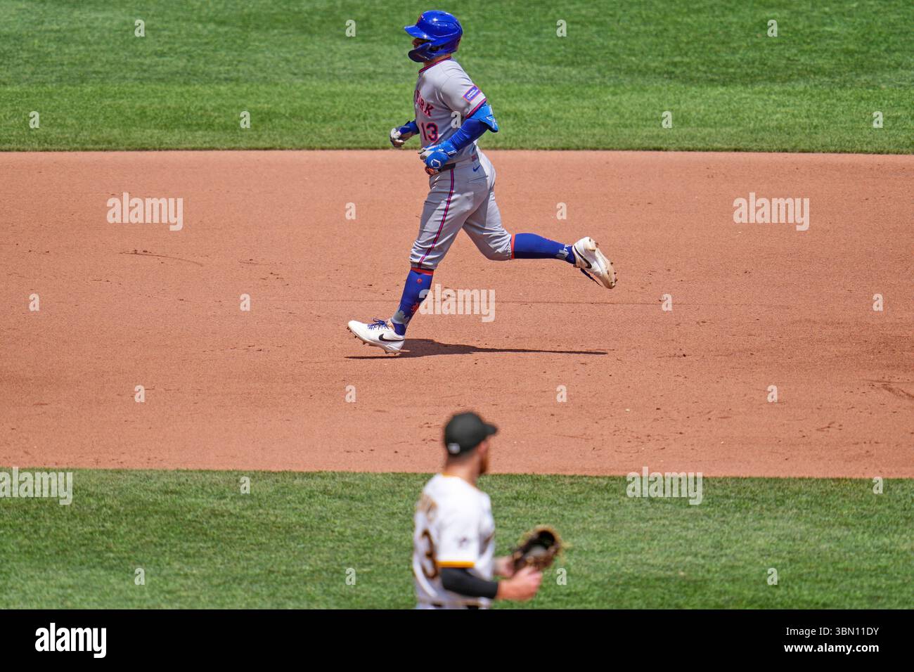 New York Mets' Luis Torrens (13) rounds the bases after hitting a solo ...