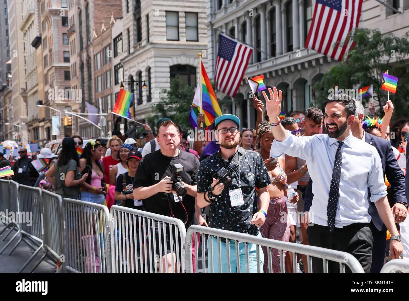 Mayoral candidate Zohran Mamdani shakes hands with the crowd lining the ...