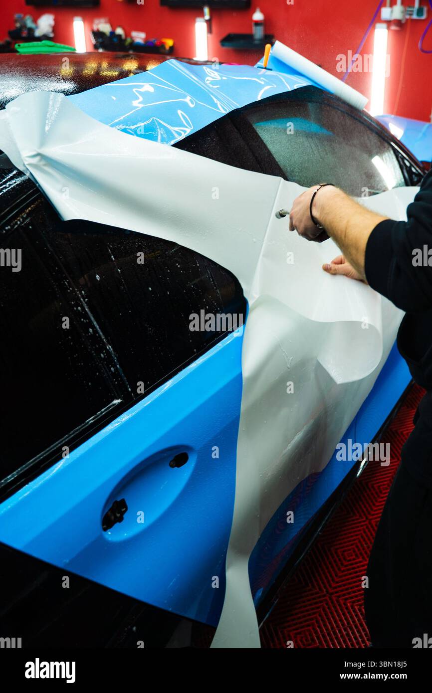 Protective film layering during PPF wrap detailing to protect the car ...