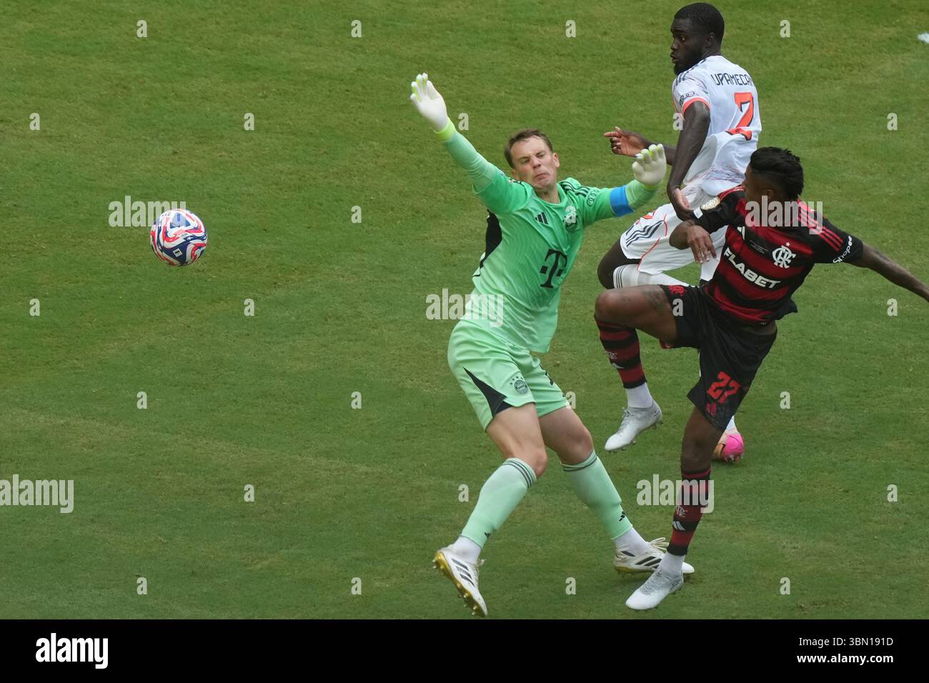 Bayern Munich's Manuel Neuer, left, blocks a shot by Flamengo's Bruno ...
