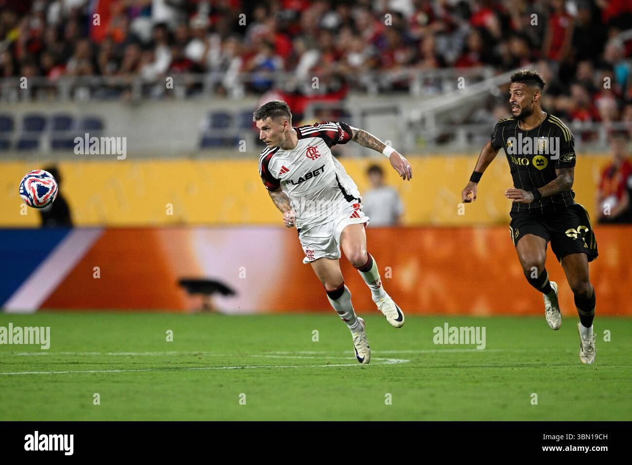Flamengo's Guillermo Varela, left, and Los Angeles FC's Denis Bouanga ...