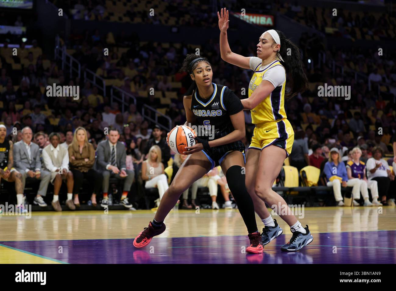 Chicago Sky forward Angel Reese, left, dribbles against Los Angeles ...