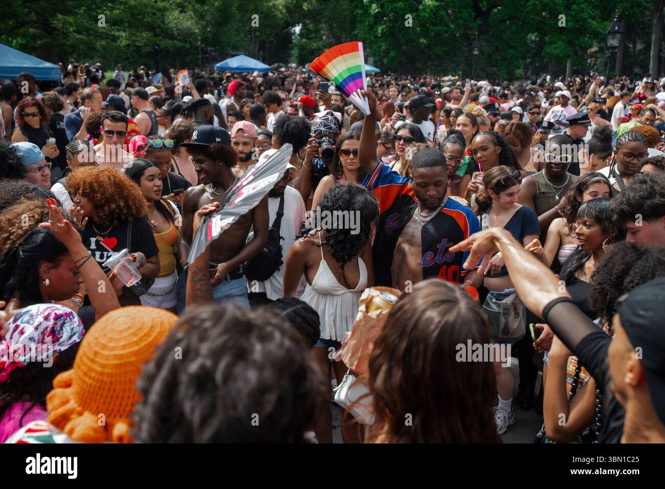 Revelers fill the Washington Square Park after the NYC Pride March on Sunday, June 29, 2025, in ...