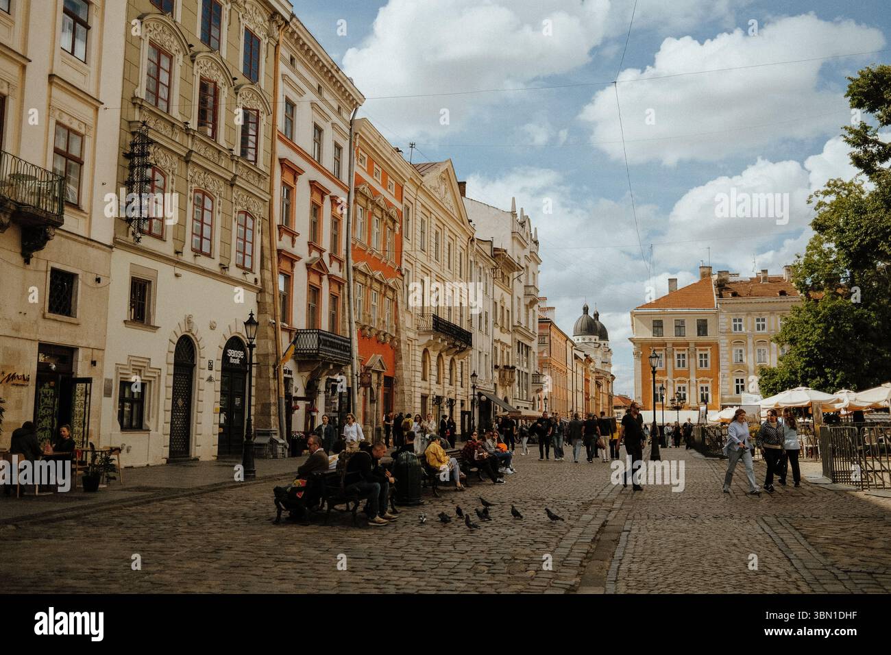 Lviv, Ukraine - June 20, 2025: Town Hall Square with people, tourists ...