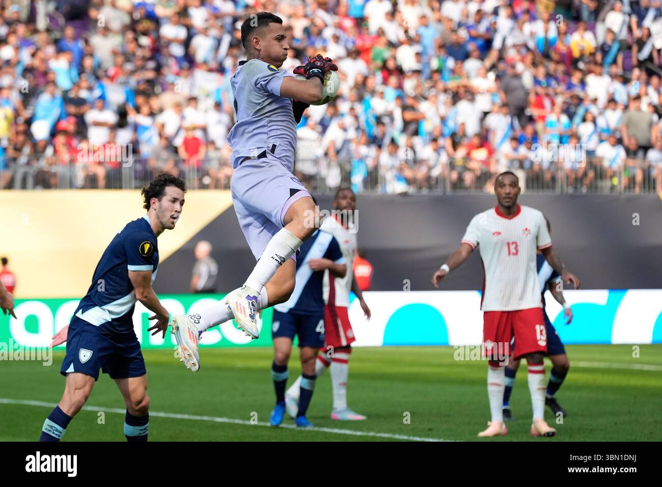 Guatemala goalkeeper Kenderson Navarro, top, stops a shot during the ...