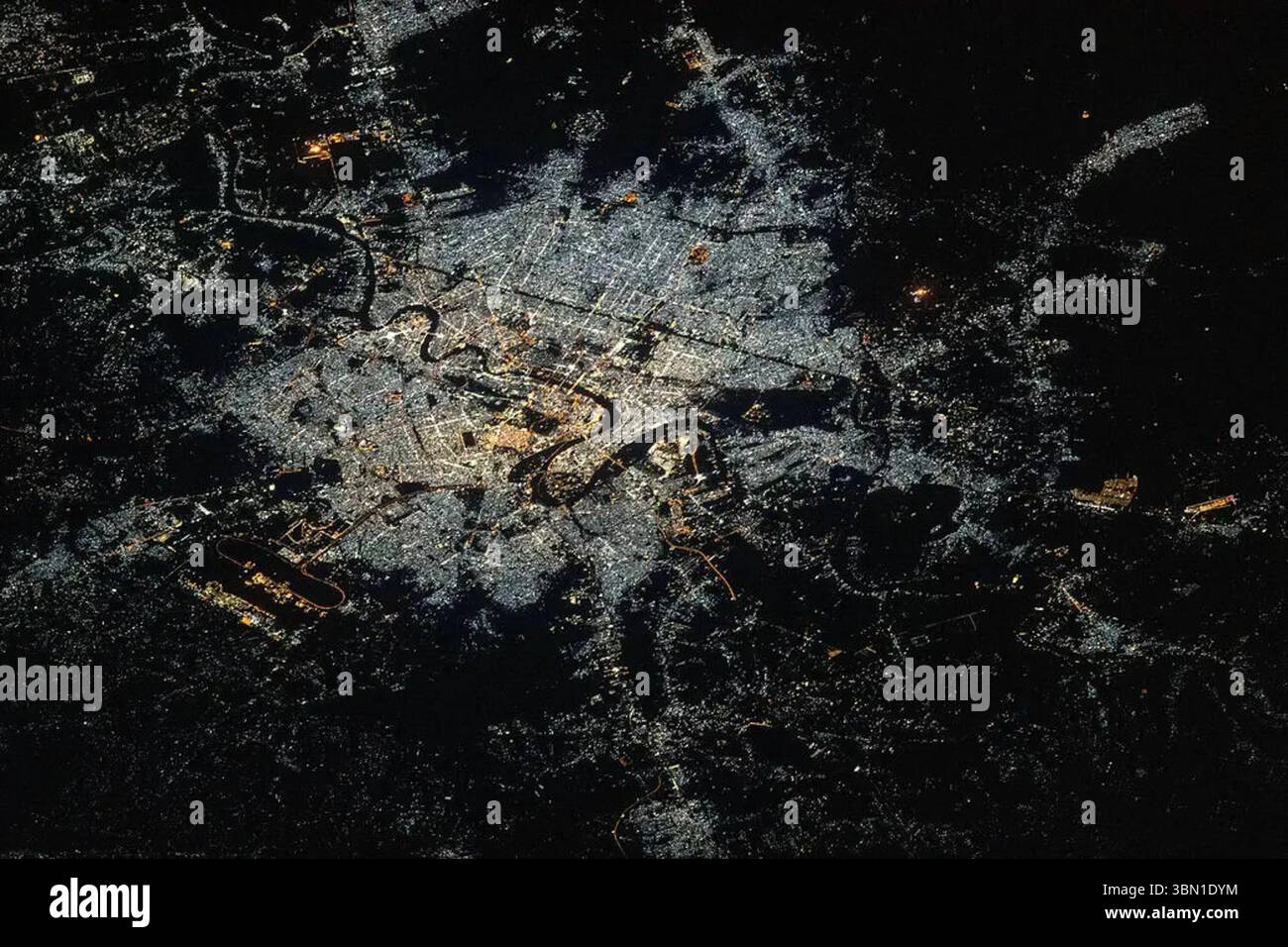 Baghdad, Iraq, is pictured illuminated at night, split by the Tigris ...