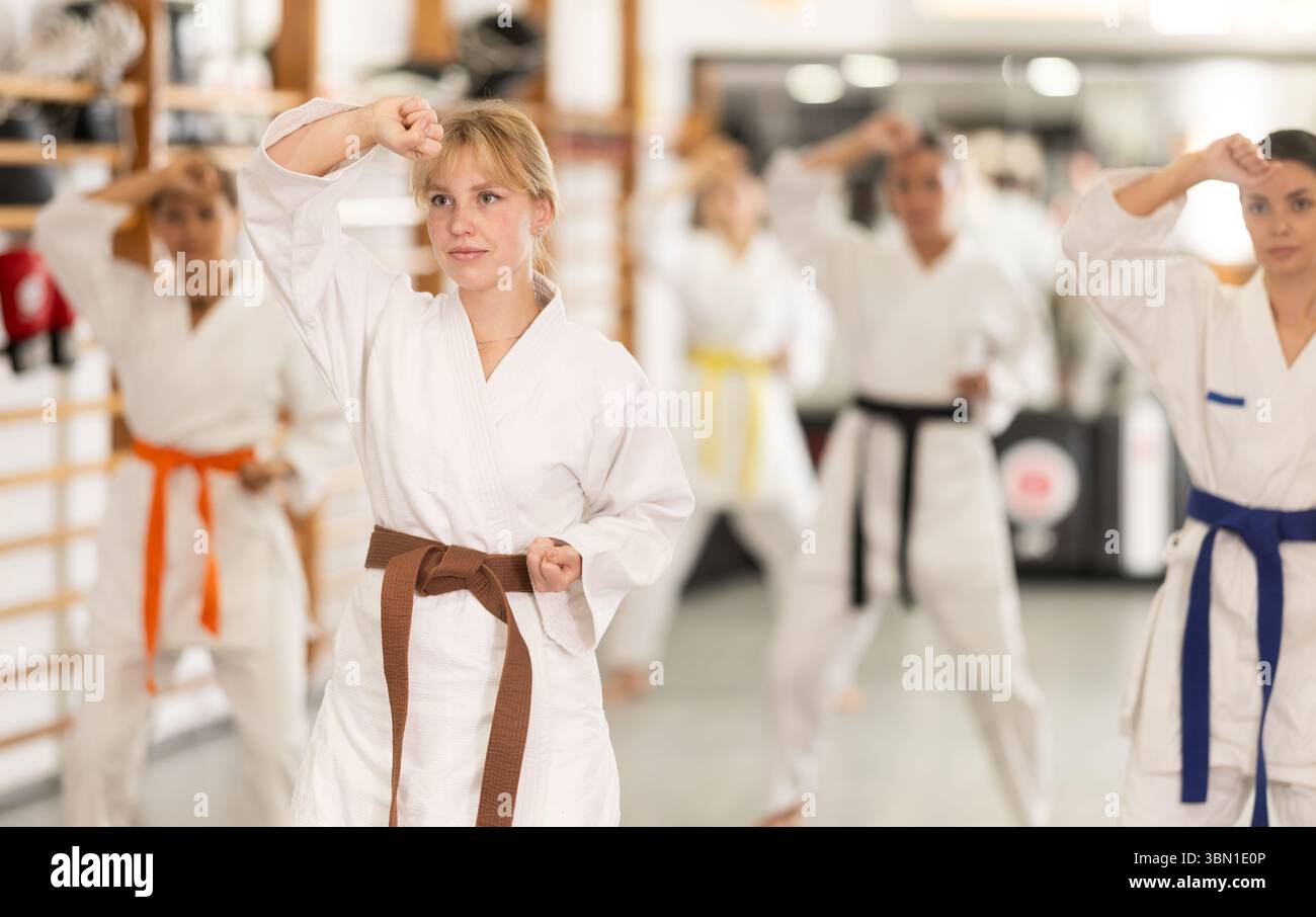 Young women during group karate training Stock Photo - Alamy