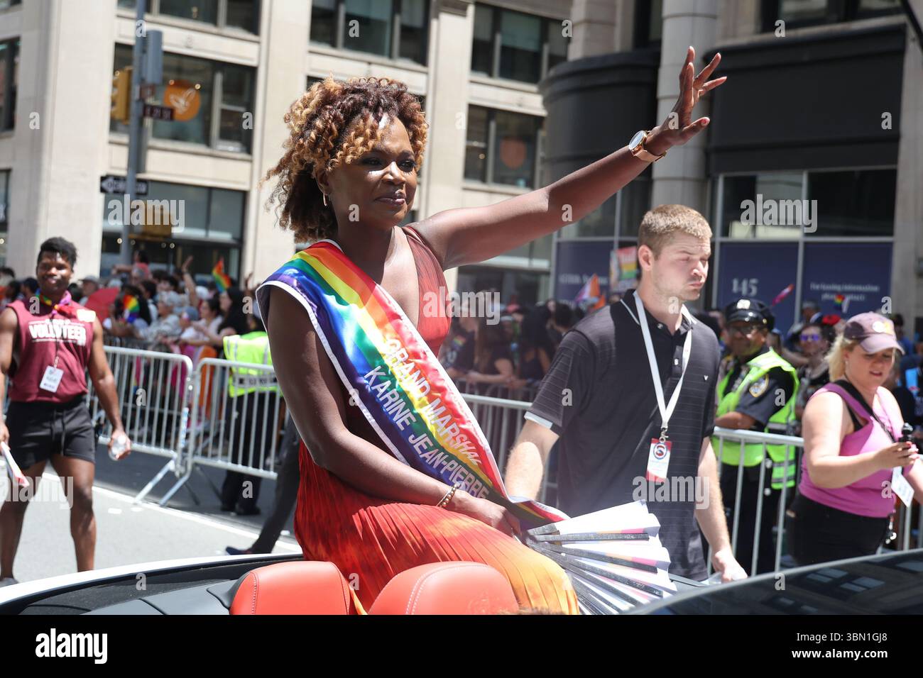 Grand Marshal Karine Jean-Pierre waves to crowds during the 2025 NYC Pride March on 5th Avenue ...