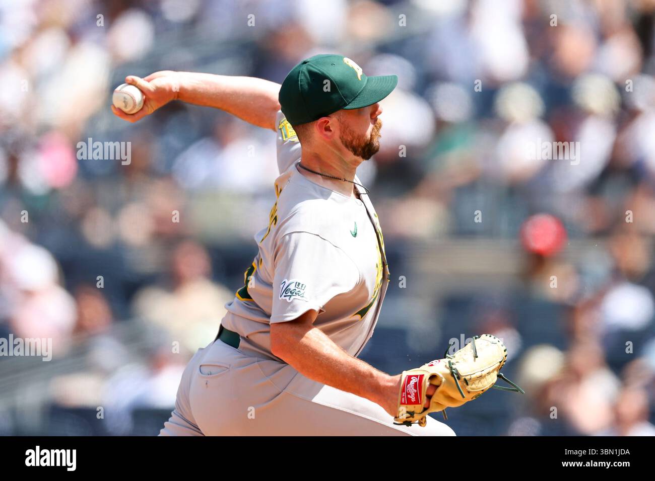 BRONX, NY - JUNE 29: Hogan Harris #36 of the Athletics pitches during ...