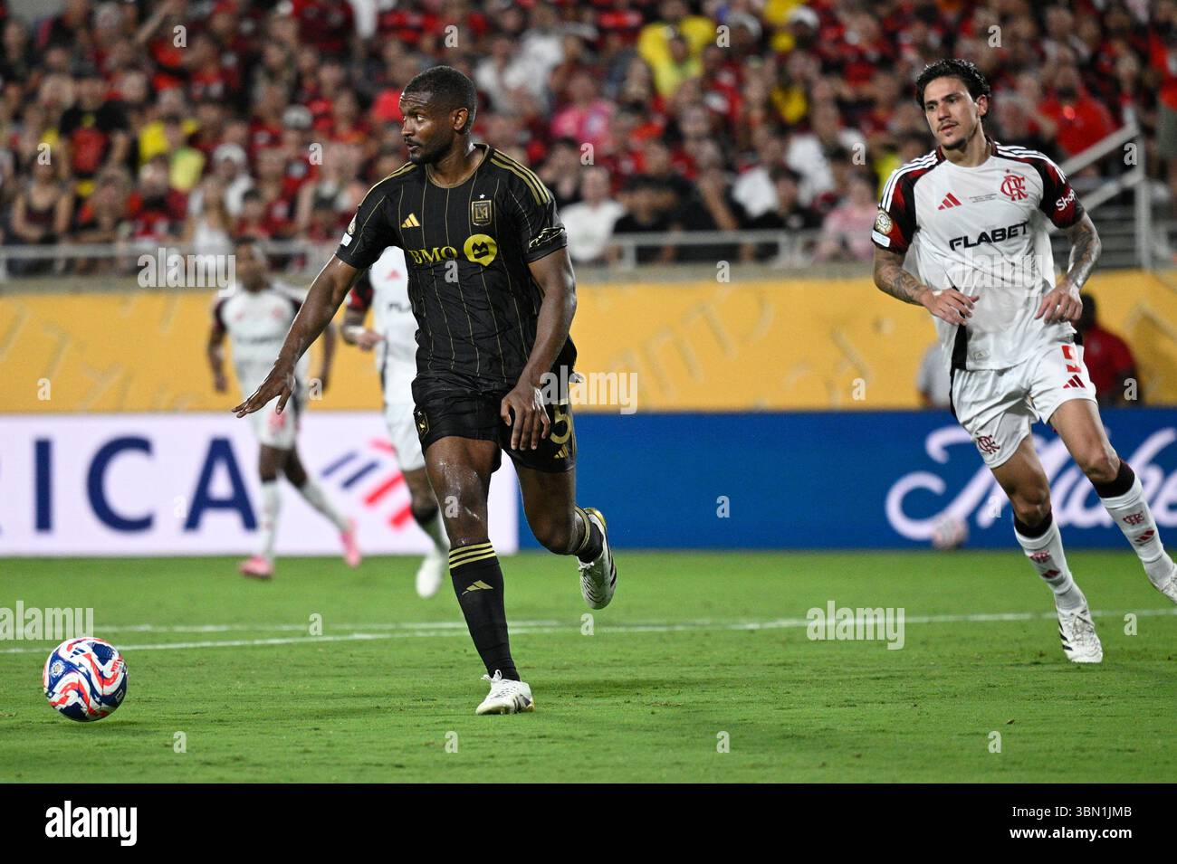 Los Angeles FC's Marlon Santos (5) and Flamengo's Pedro (9) compete for ...