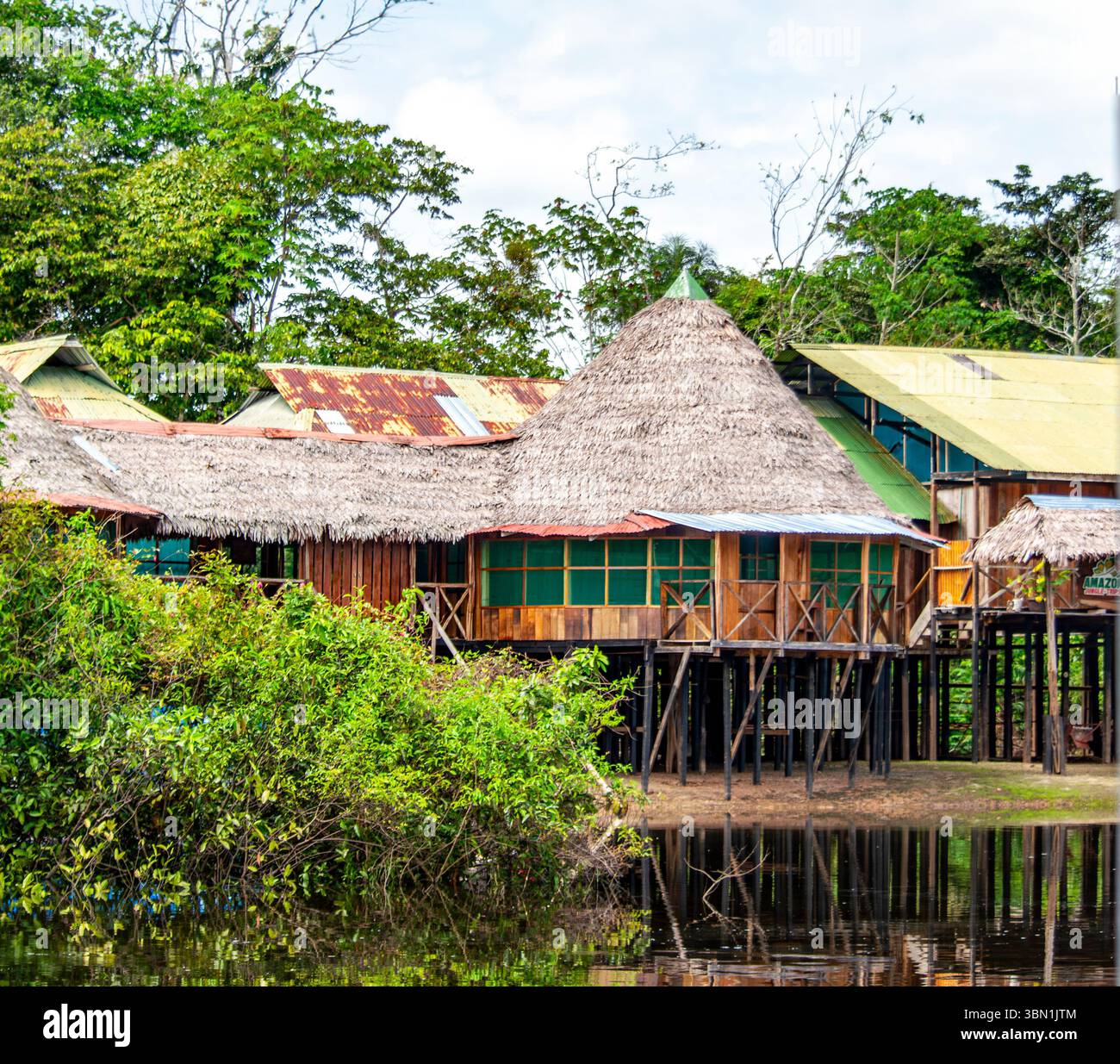 Houses on stilts in rainforest hi-res stock photography and images - Alamy