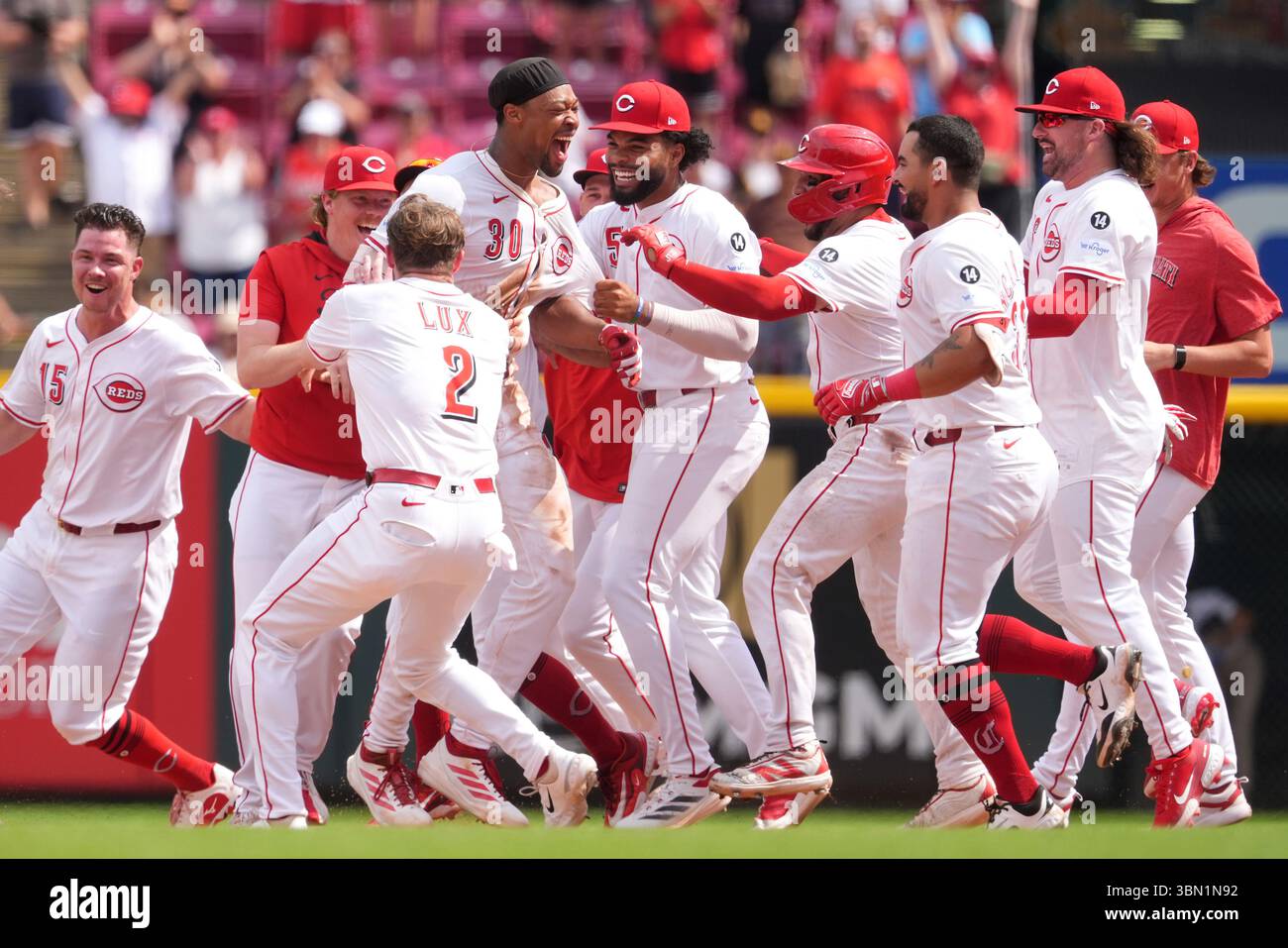 Cincinnati Reds' Will Benson, center, is congratulated by teammates ...