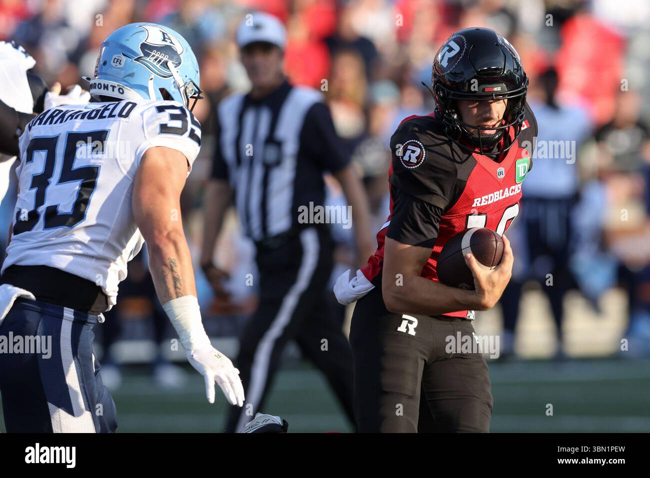June 29, 2025: Ottawa Redblacks quarterback Dustin Crum (18) runs ...