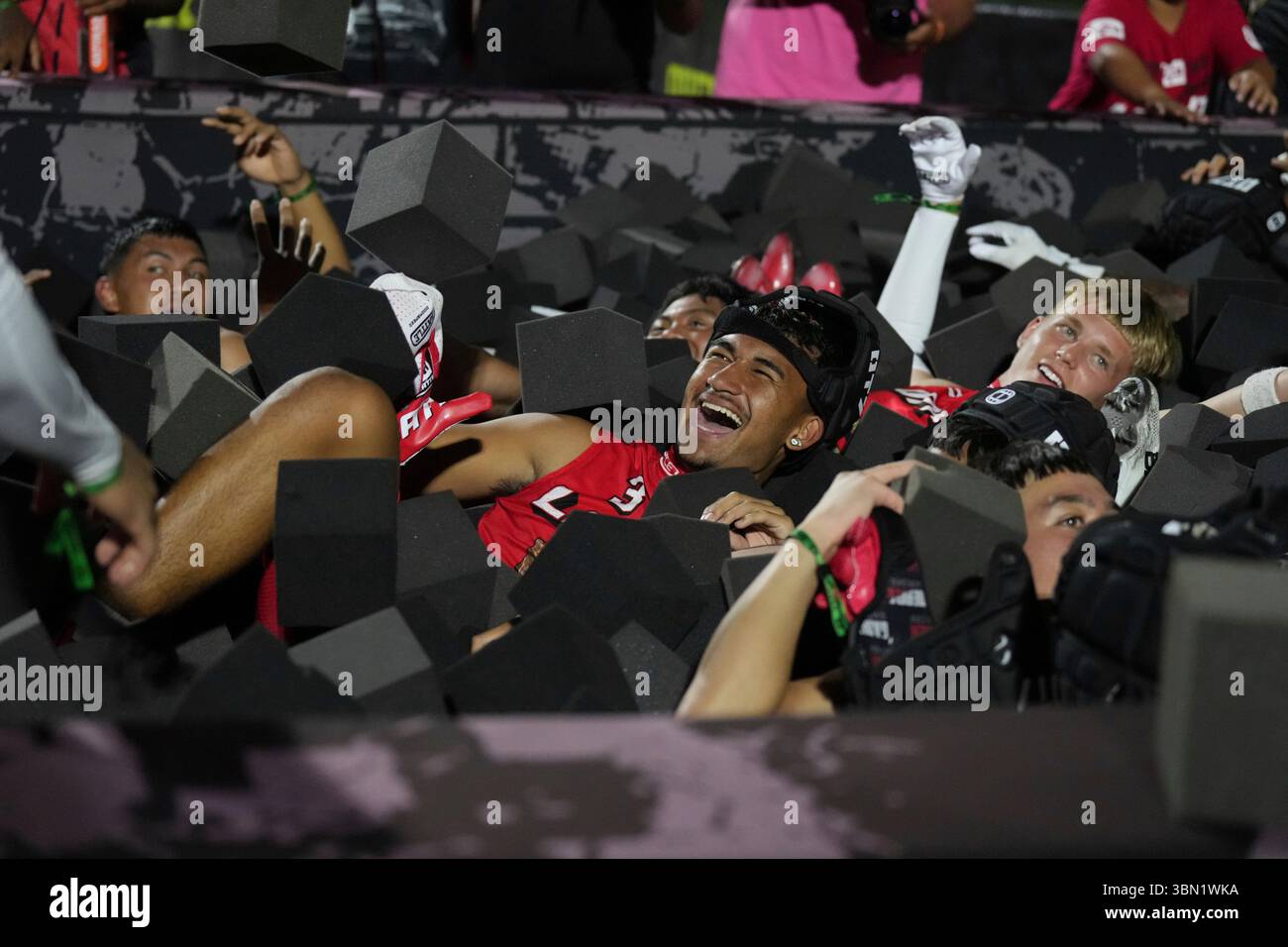 Lo-Pro receiver Tanoah Kauhi (3) celebrates in a foam pit with ...