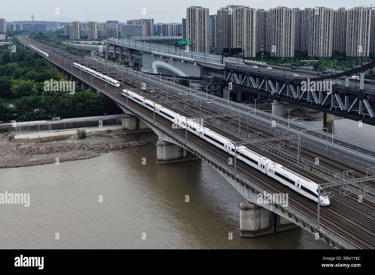 HANGZHOU, CHINA - JUNE 30, 2025 - A high-speed train passes through ...