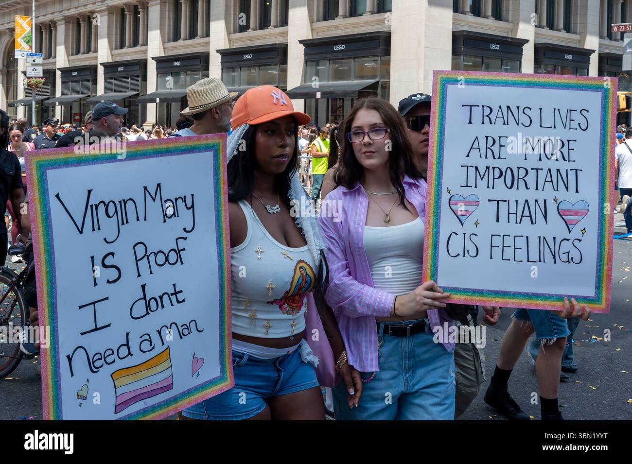 NEW YORK, NEW YORK - JUNE 29: Participants holding signs during the annual New York City Pride ...