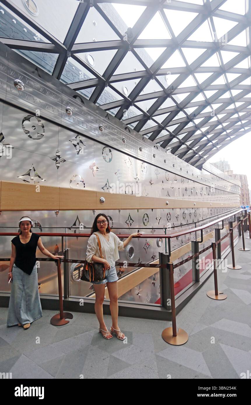 Tourists visit the world's only giant wheel-shaped building of French ...