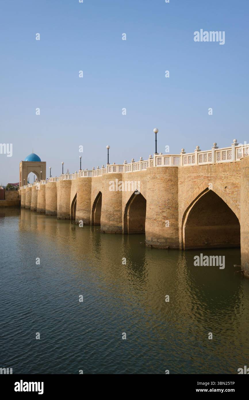 A new, brick arch bridge over the Kashkadarya river. In Qarshi ...