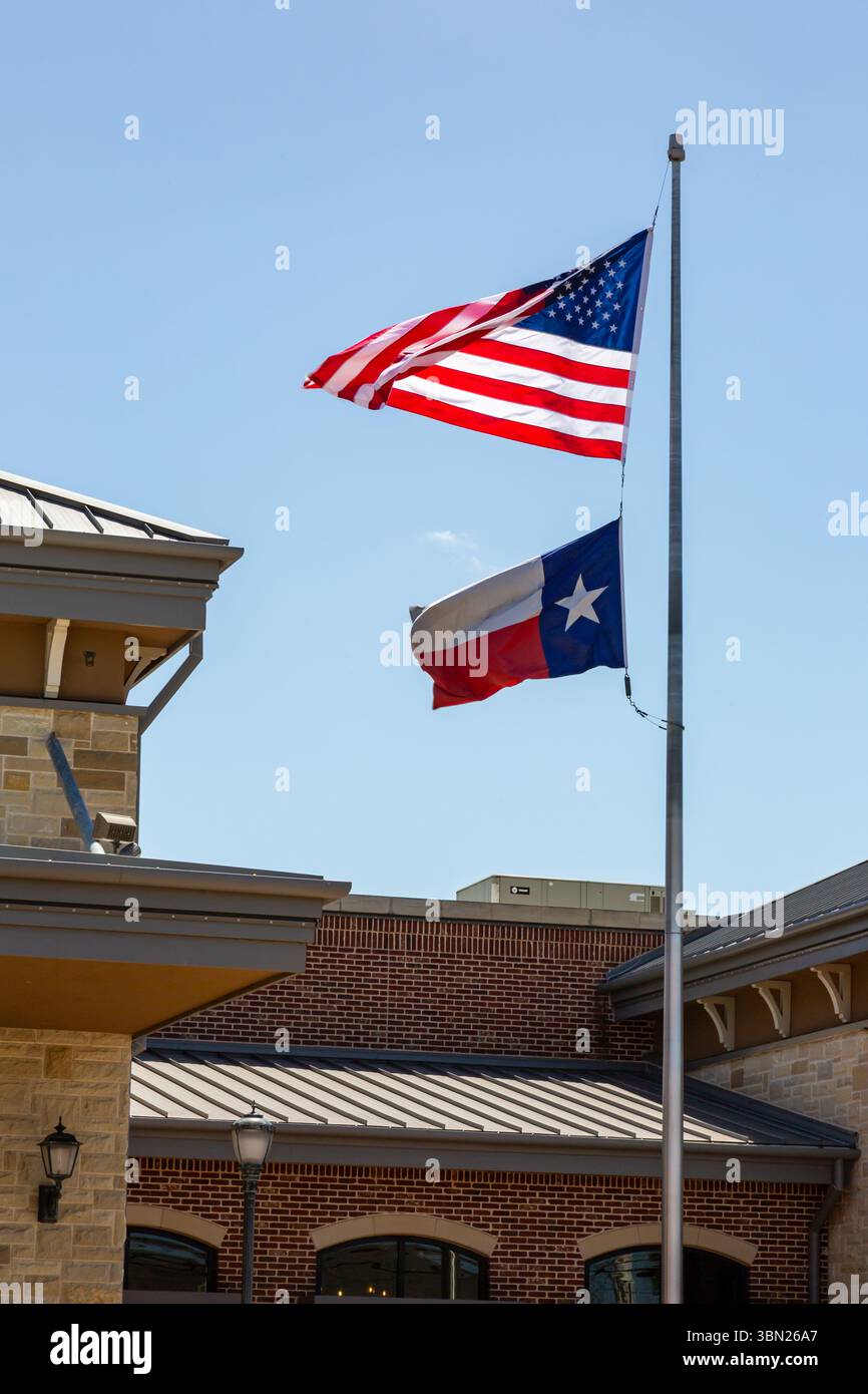 The flags of the United States of America and Texas fly over the Dudley ...