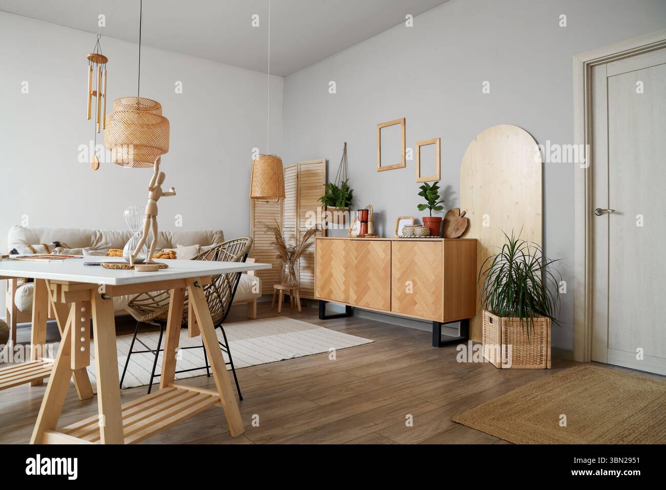 Interior of light room with wind chime and artist's workplace Stock ...