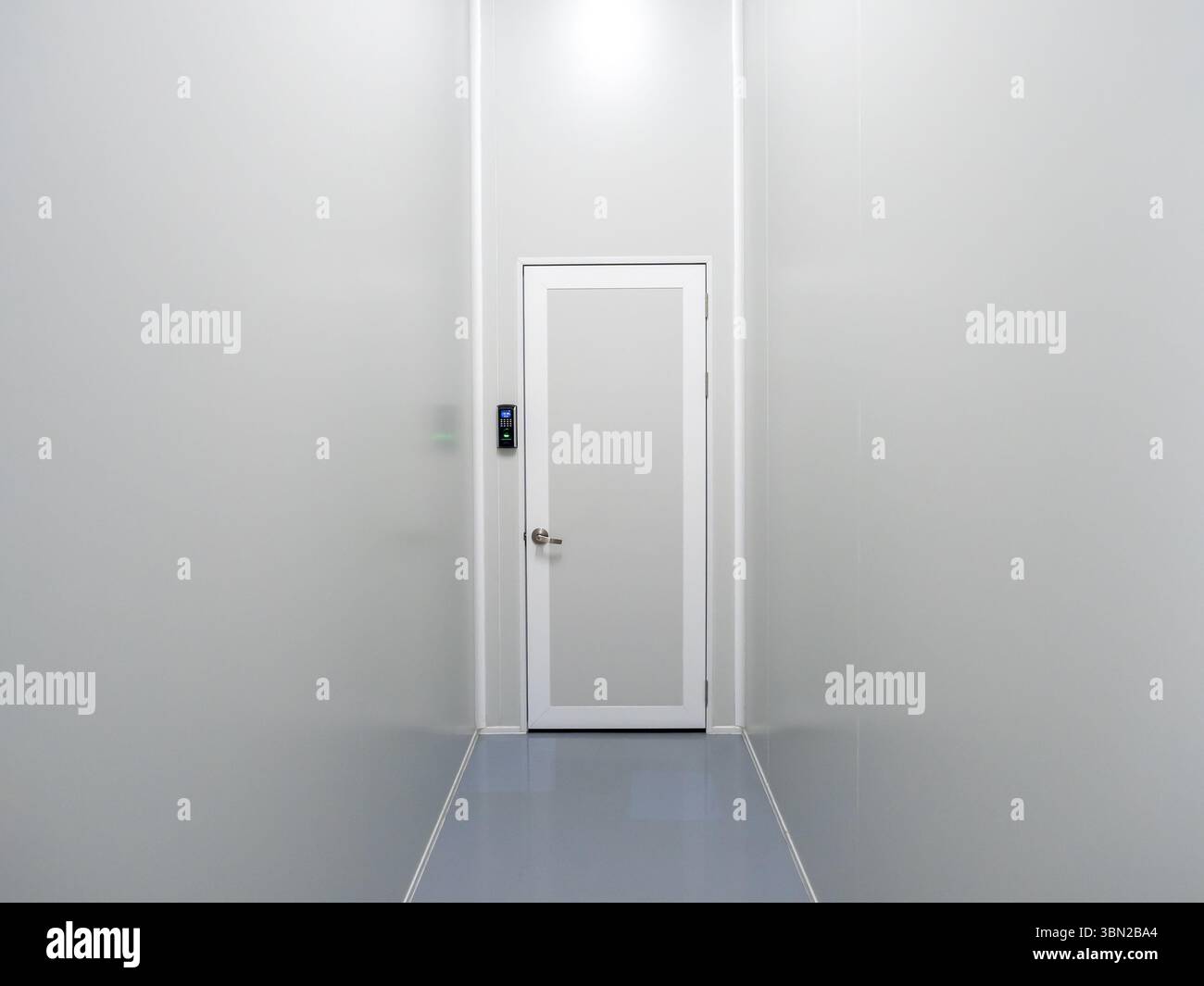 Scene of narrow corridor with finger scanner of entrance door room and ...