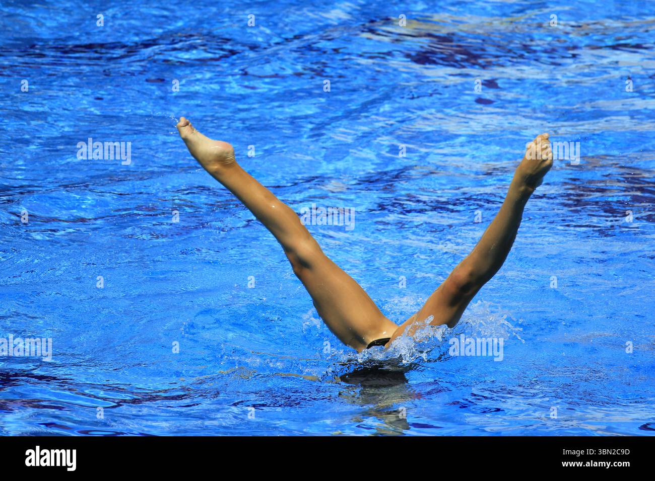 A swimmer's feet are above the surface of the water when half of his ...