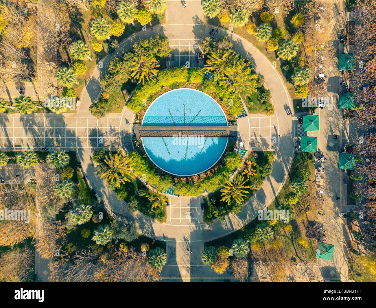 Top-down view of a circular fountain with surrounding park pathways ...