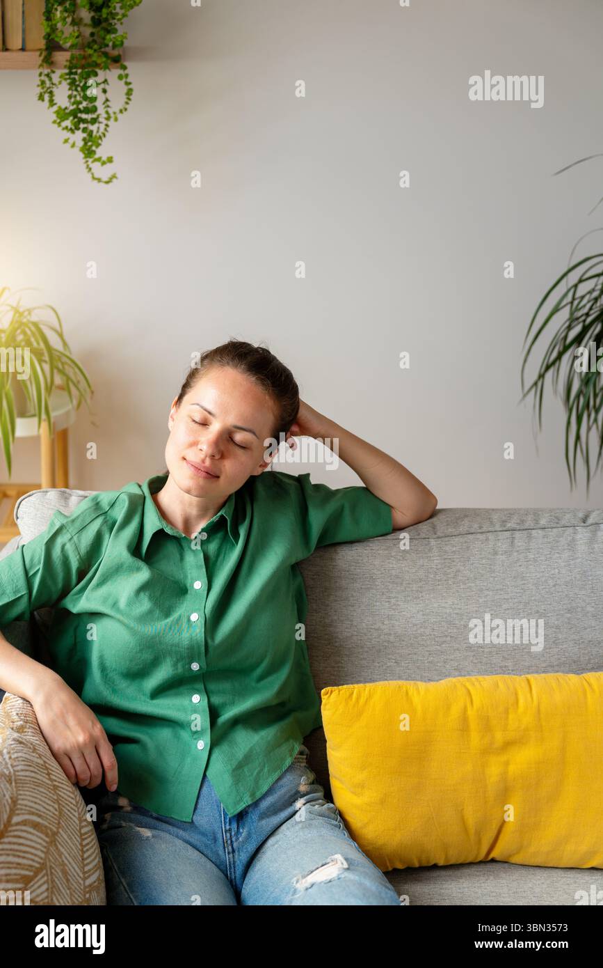 Caucasian woman sitting comfortably on hi-res stock photography and ...
