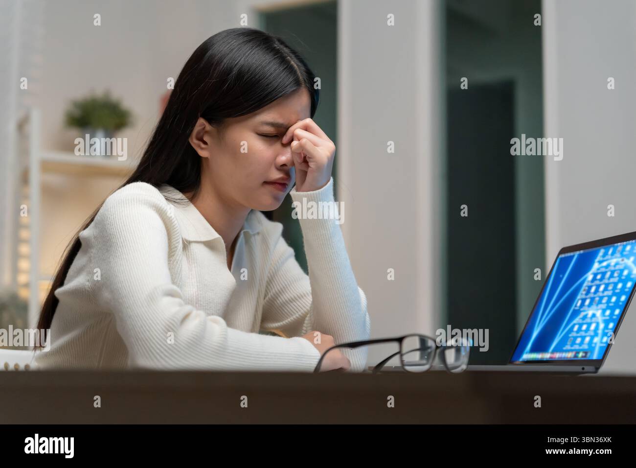 Eye problems, Asian women with tired and irritated eyes, eye rubbing ...