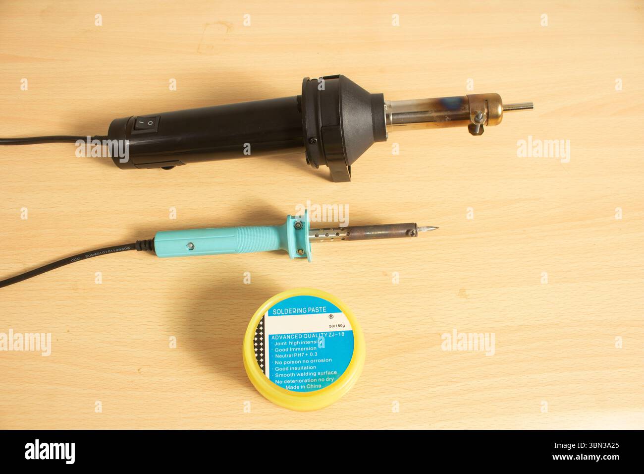 heat gun soldering iron and paste isolated on neutral background top ...