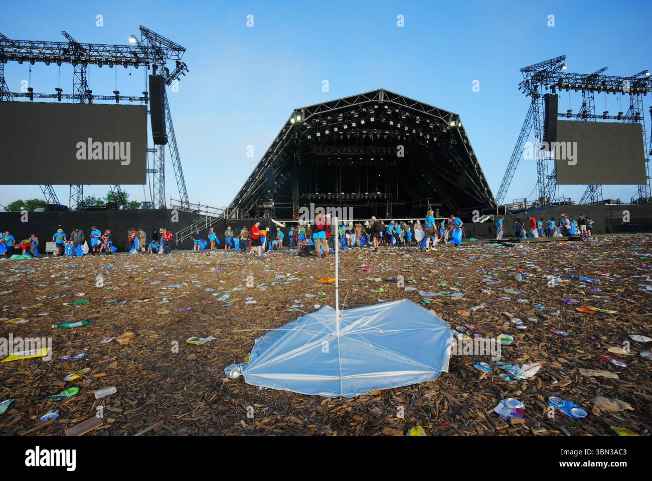 The clean up operation begins in a field covered in litter at the end ...