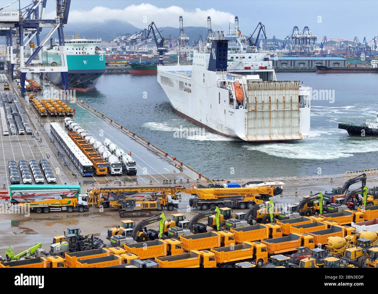 YANTAI, CHINA - JUNE 29, 2025 - A car carrier is loading export cars at ...
