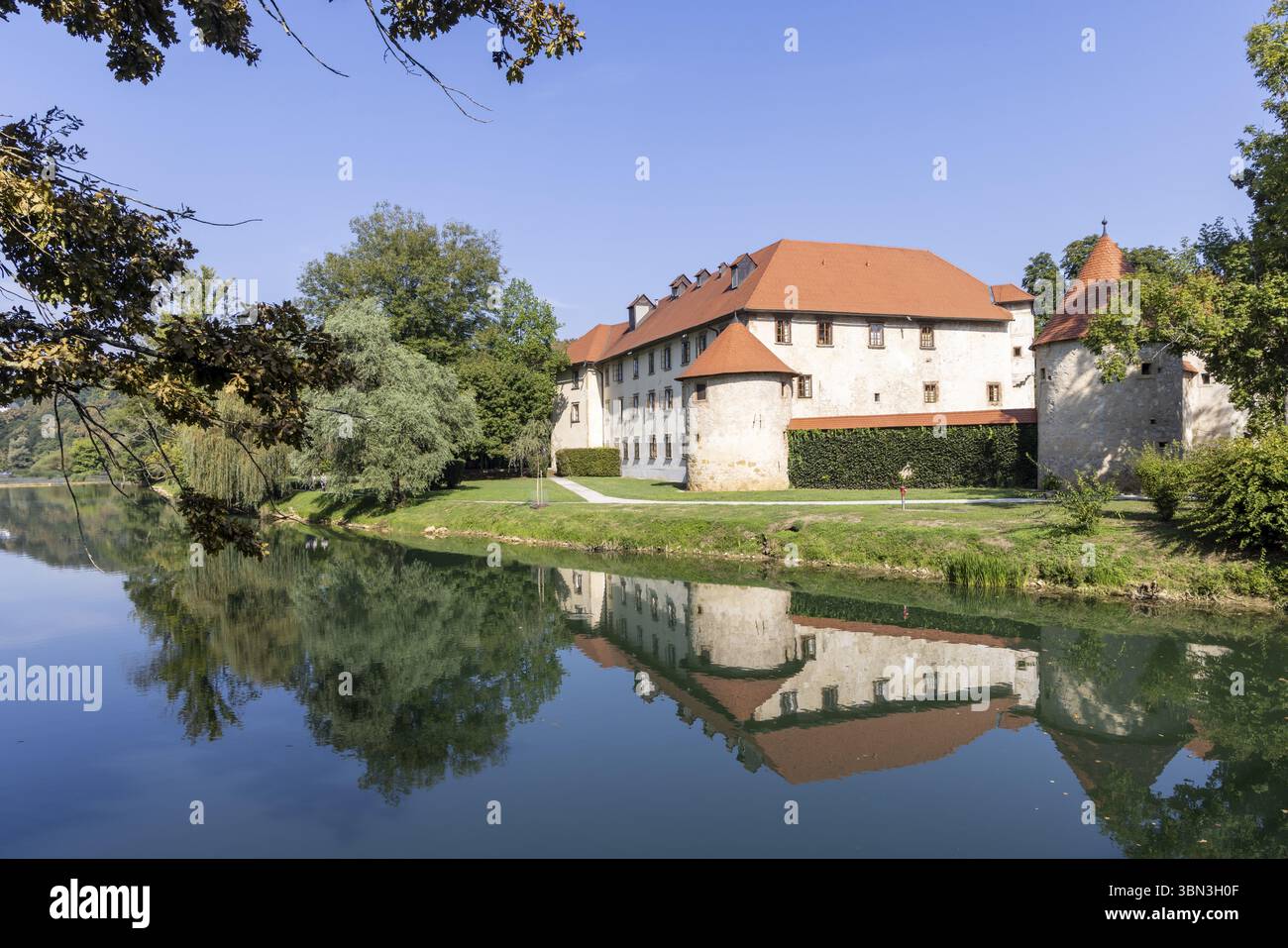 Scenic view of Otocec Castle at small island in Krka river in Slovenia ...