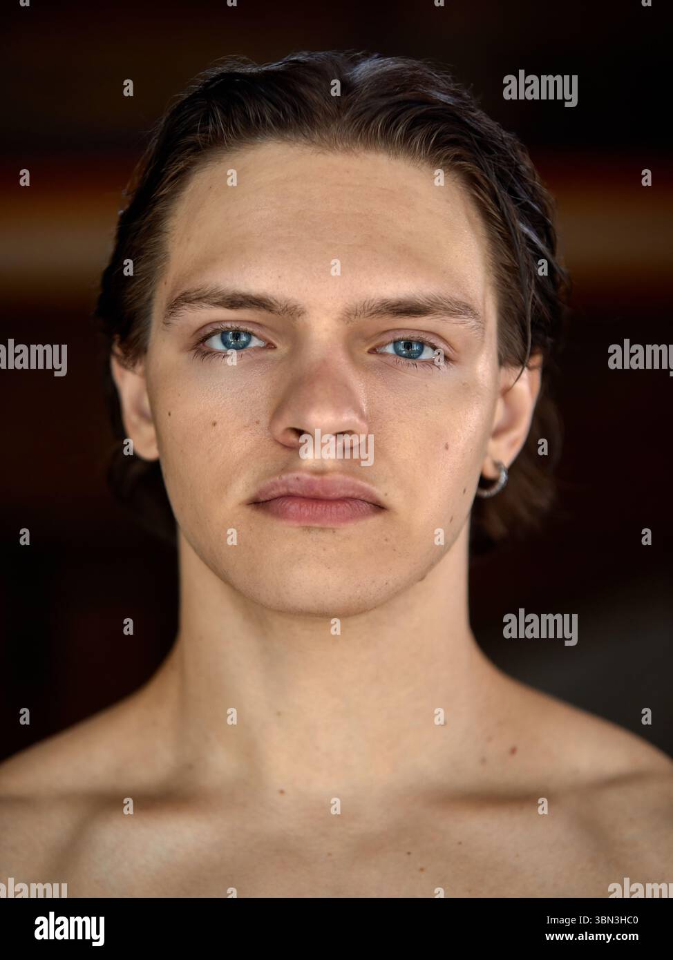 Clean minimal. Young man with blue eyes and confident expression. Sharp ...