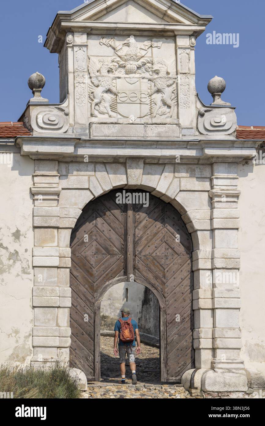 Male tourist entering medieval castle of Ptuj in Styria region in ...