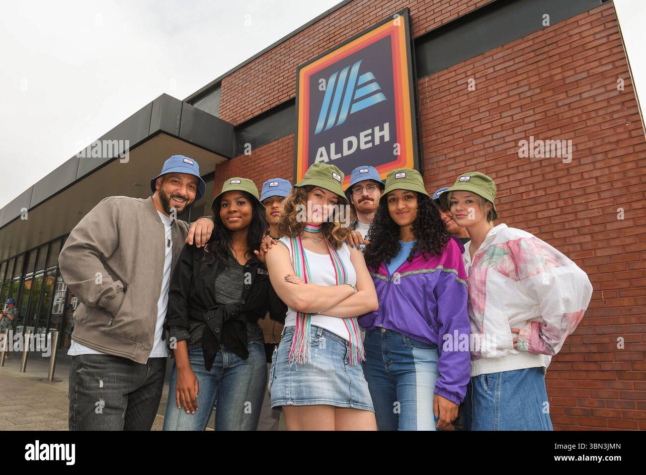 EDITORIAL USE ONLY Shoppers and passerbys outside of the Aldi store in ...
