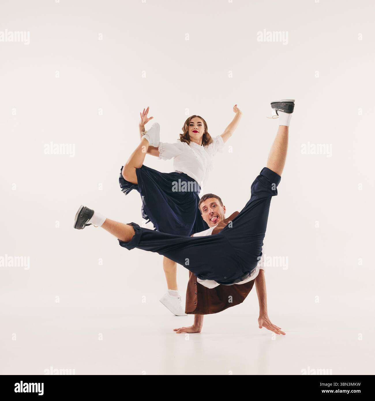 Energetic lindy hop dancers performing dynamic retro dance moves in ...