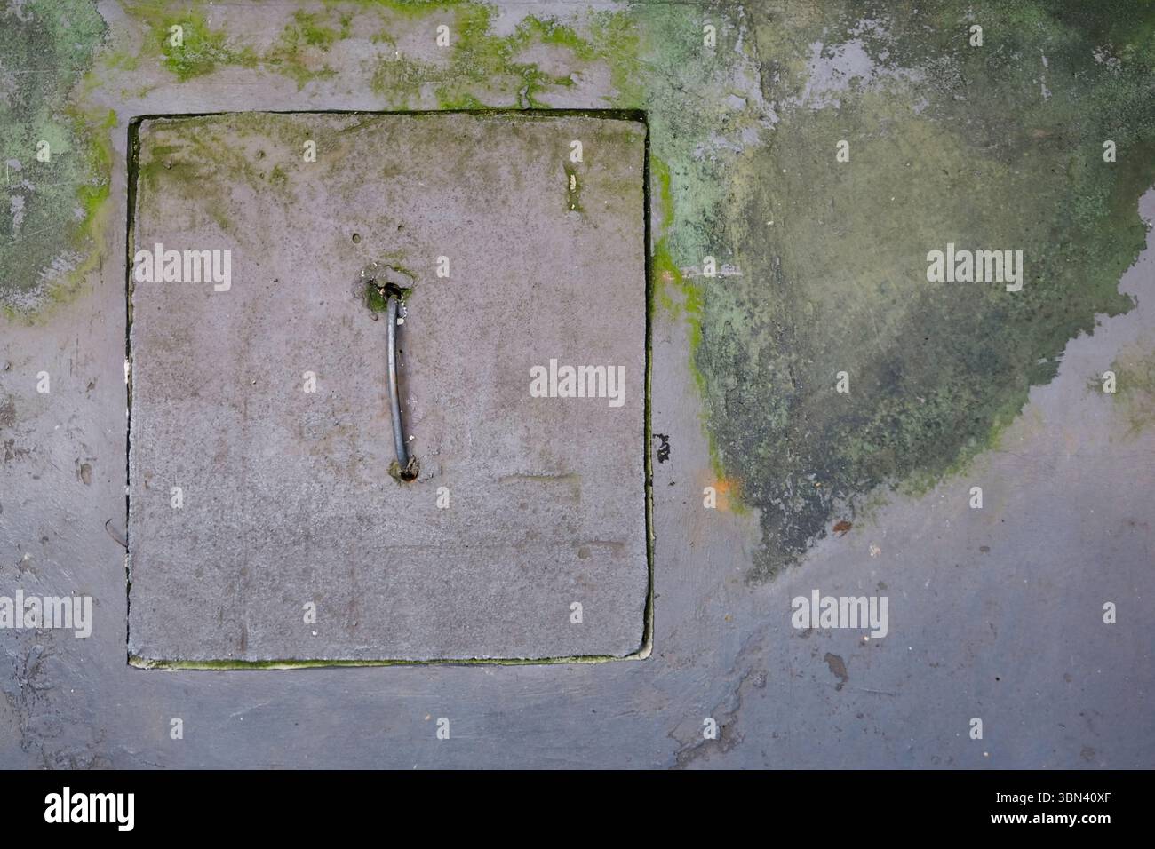 Close-up view of septic tank manhole cover Stock Photo - Alamy