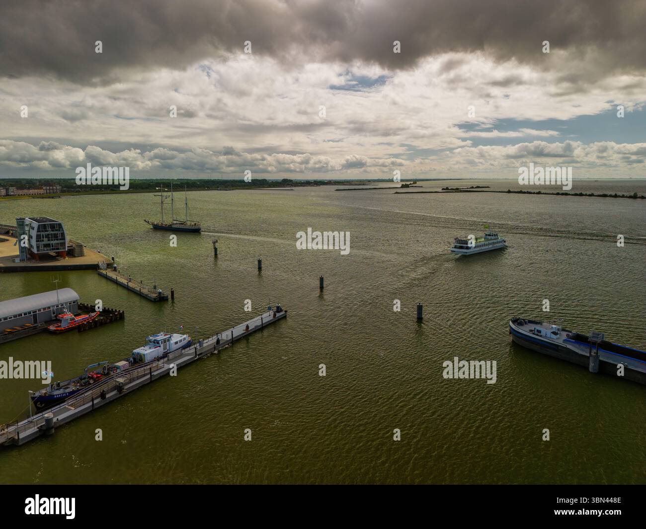 Aerial view of a harbor with several boats and ships on a large body of ...