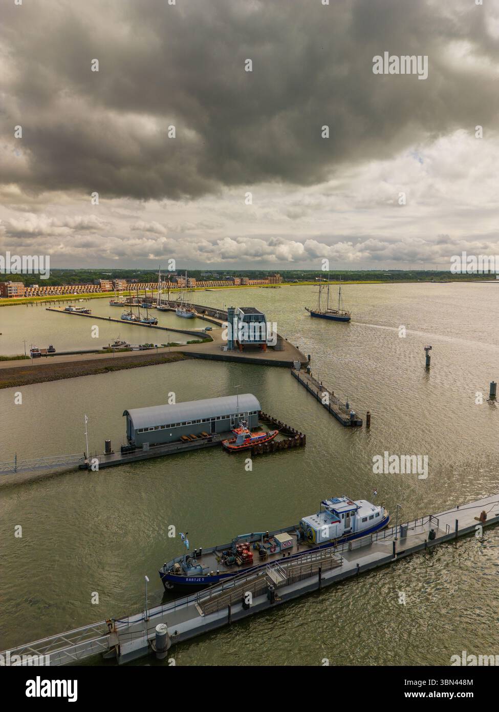 Aerial view of a harbor with several boats and ships on a large body of ...