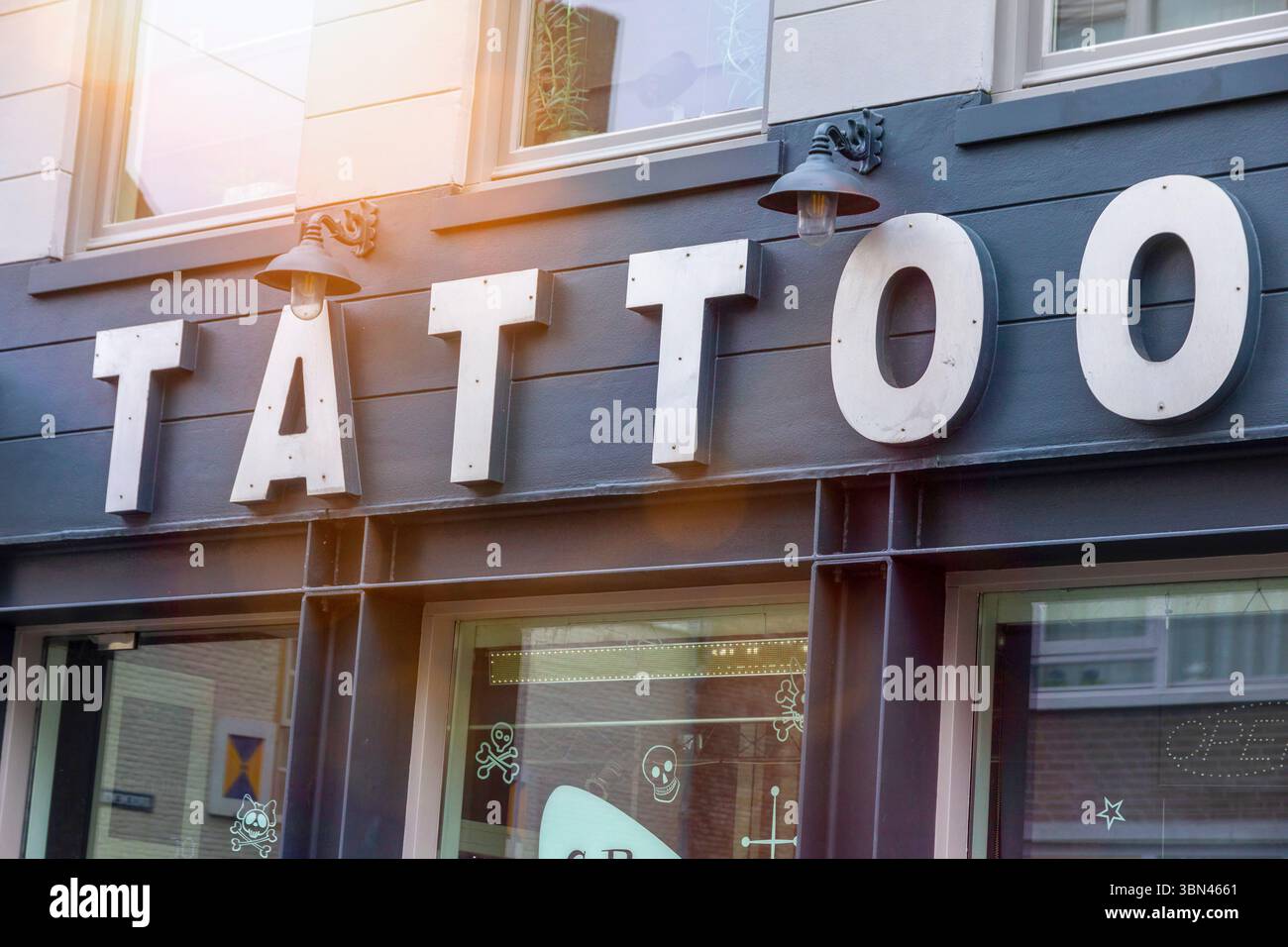 Tattoo artist sign Stock Photo - Alamy