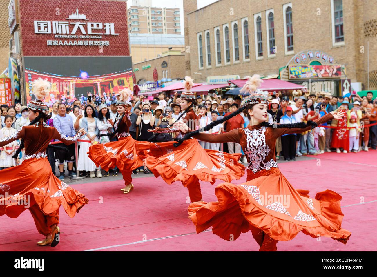 Tourists visit the Grand Bazaar in Urumqi City, northwest China's ...